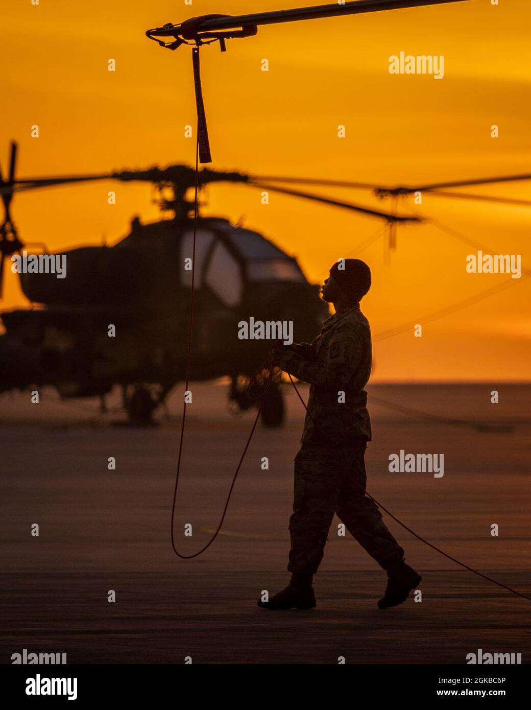 U.S. Army Spc. Gevanei Malcolm, an AH-64 crew chief assigned to the ...