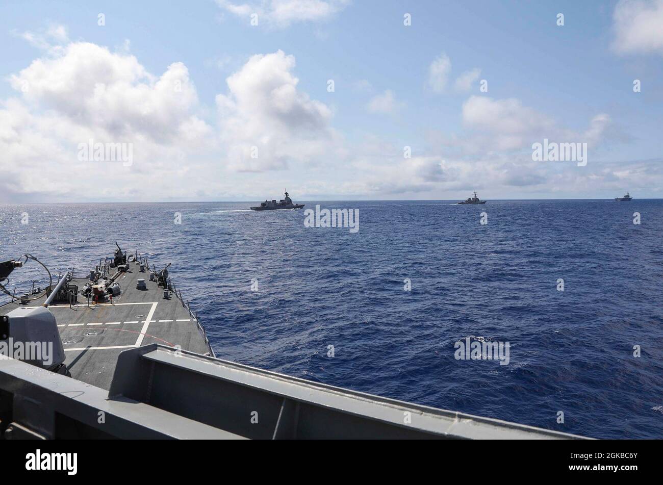 The Arleigh Burke-class guided-missile destroyers USS Benfold (DDG 65 ...