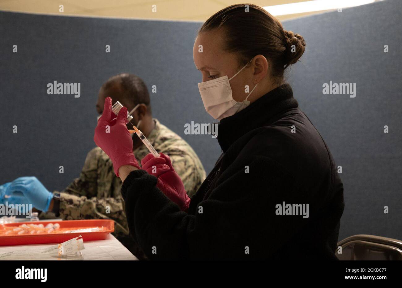 U.S. Navy Lt. Courtney Corcoran, a pharmacist assigned to Naval Medical ...