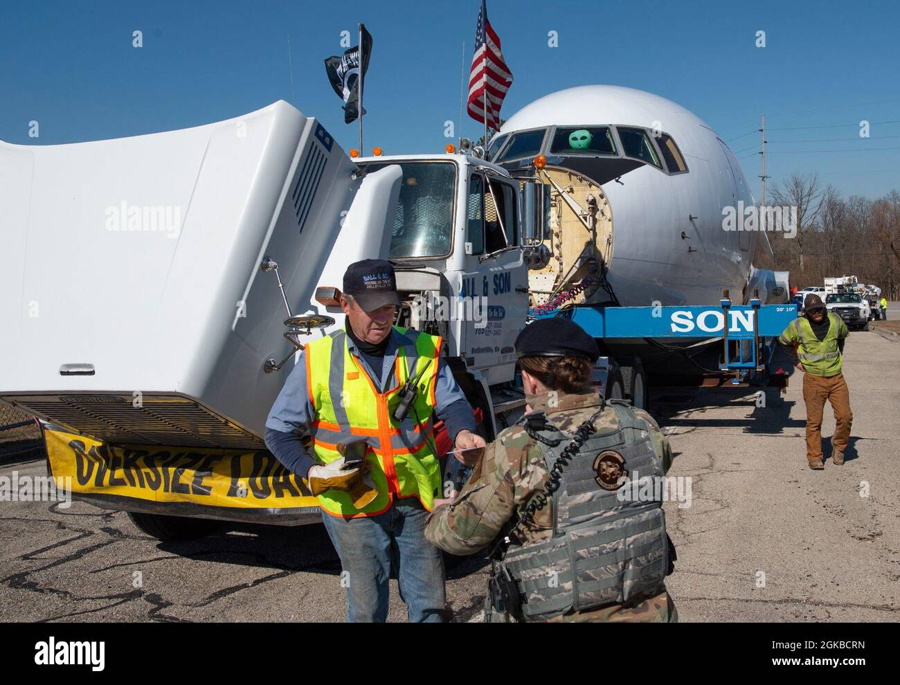 Leon Ball, Ball and Son Movers, shows his license and paperwork to an ...