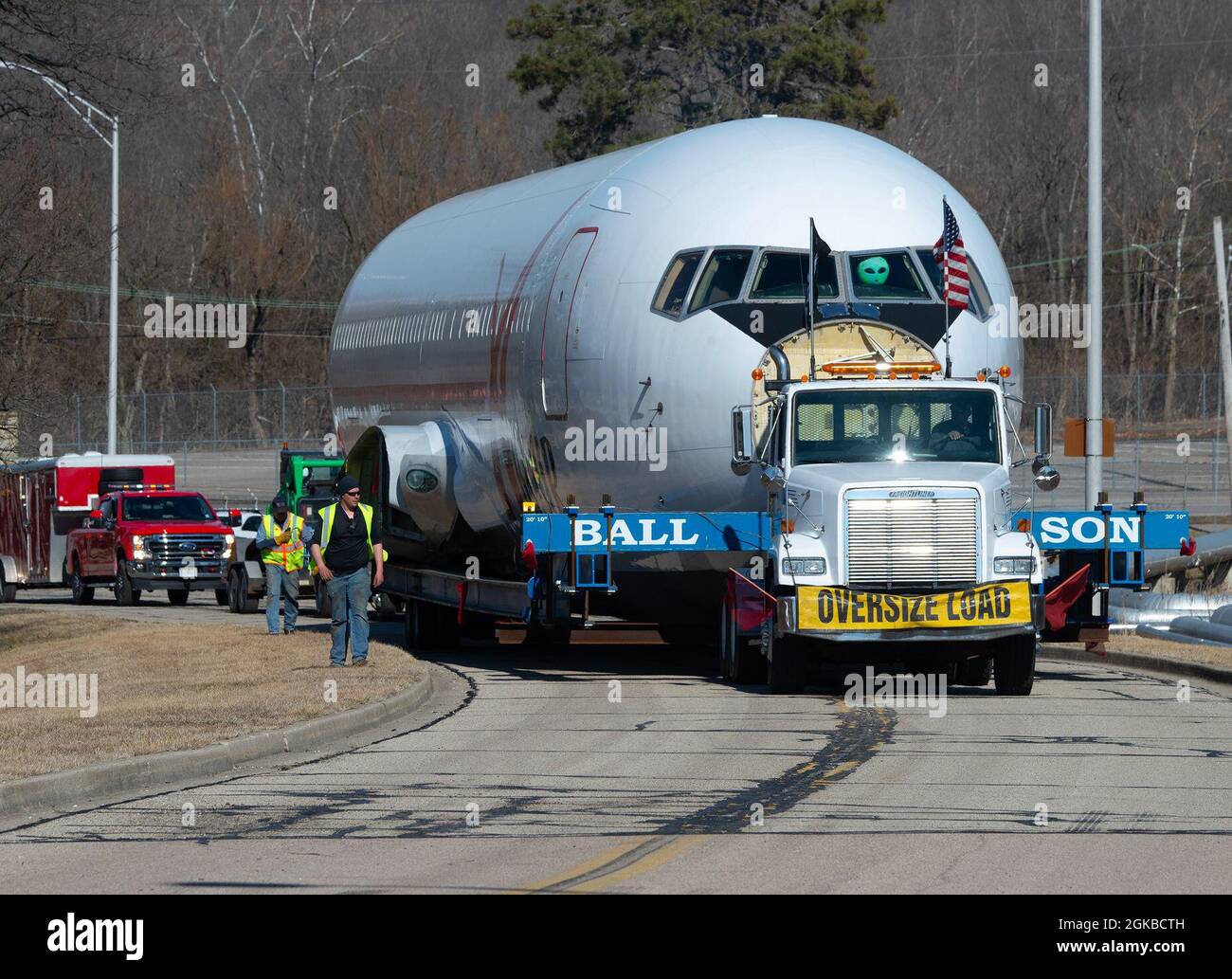 A truck pulls the fuselage of a Boeing 767 up a hill March 3, 2021, on ...