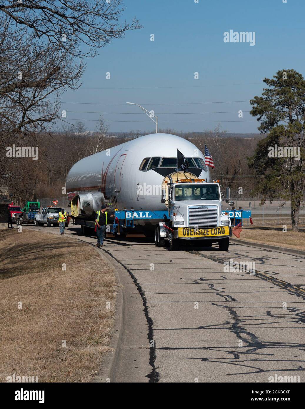 A truck pulls the fuselage of a Boeing 767 up a hill on March 3, 2021 ...