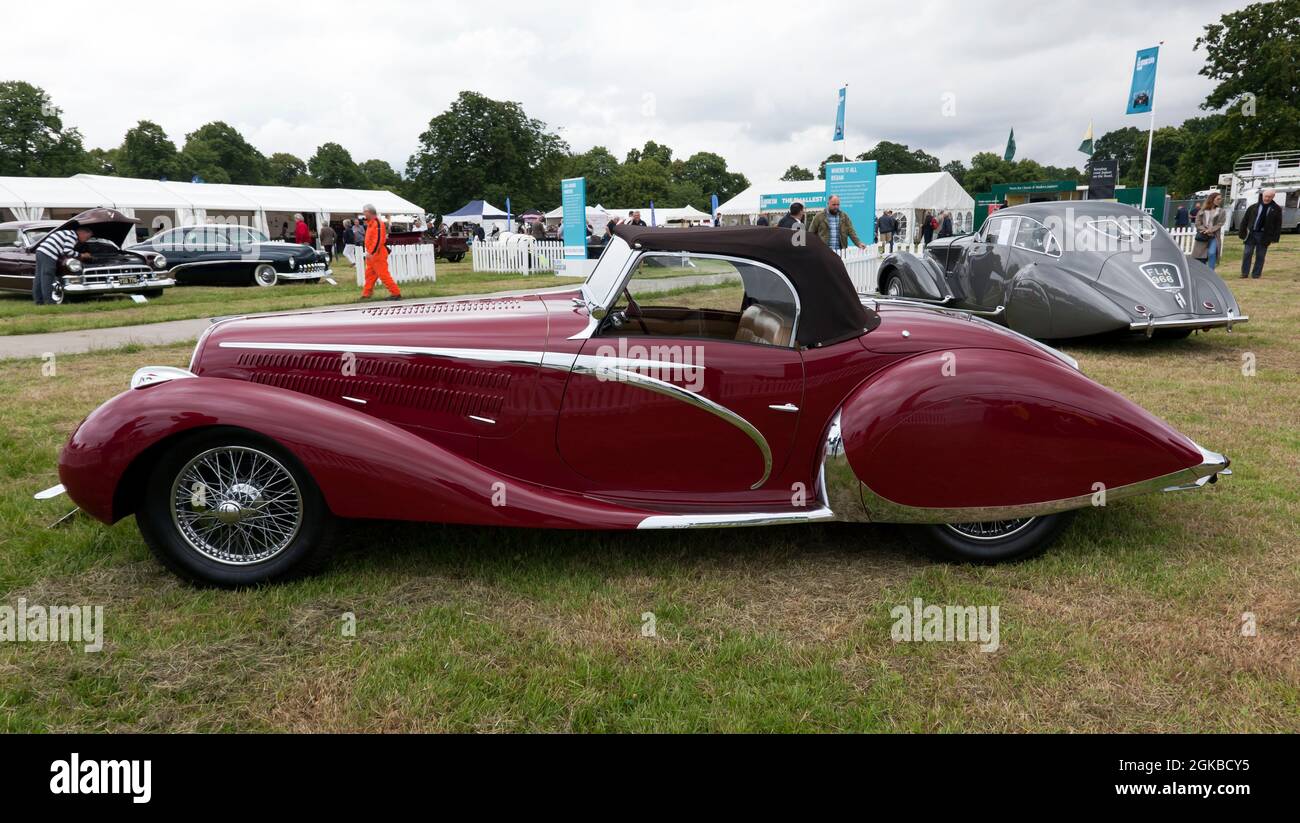 Side view of a Red, 1938, Delahaye 135MS on display in the 1930's Style ...