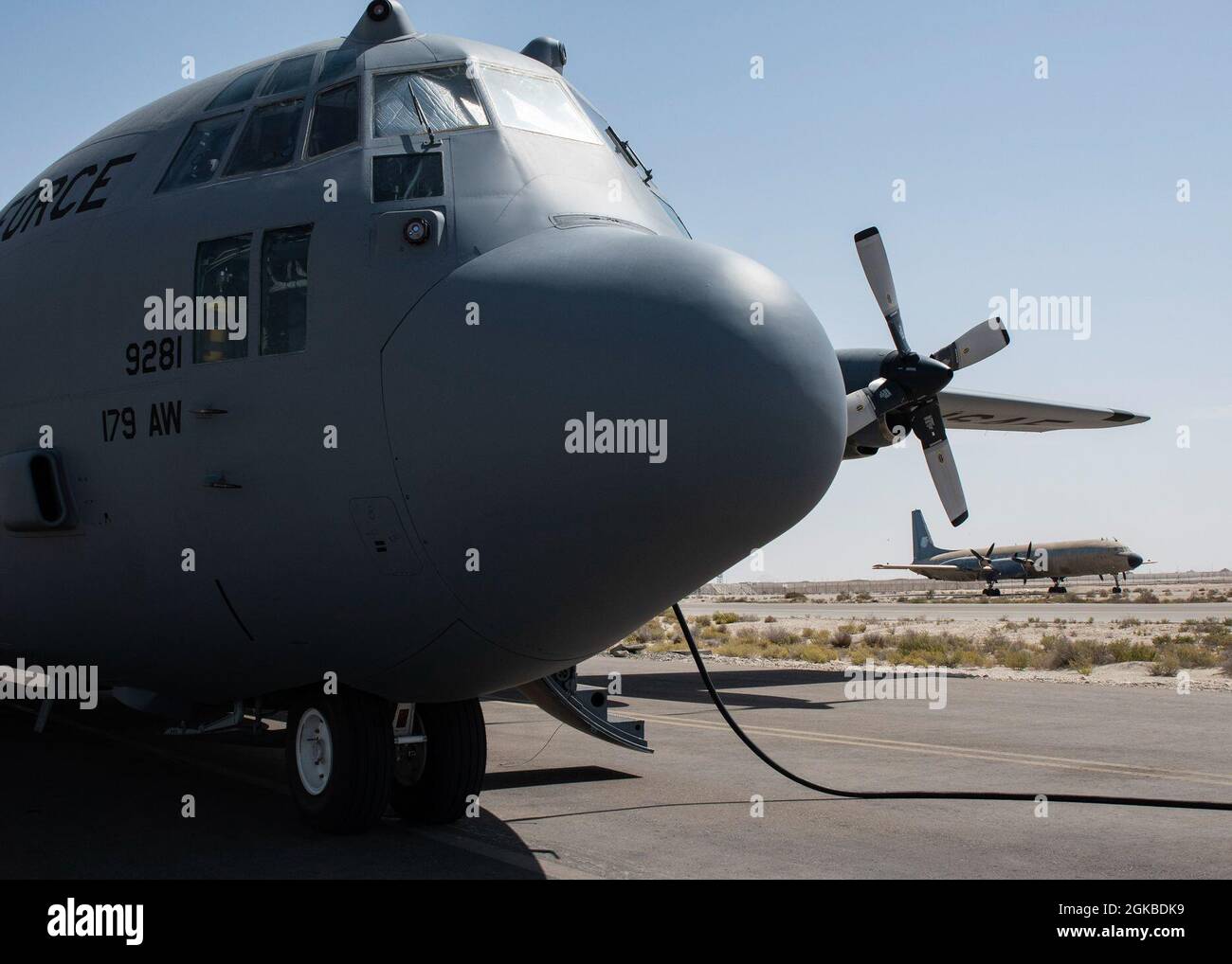A U.S. Air Force C-130 Hercules aircraft is loaded with cargo during a ...