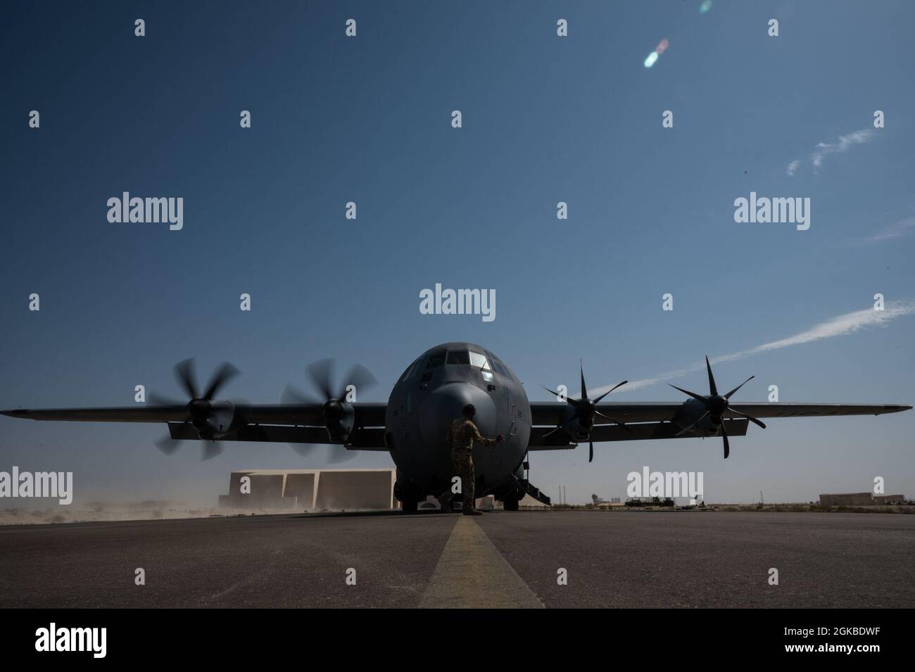 A U.S. Air Force loadmaster watches engine start up for a C-130J Super ...