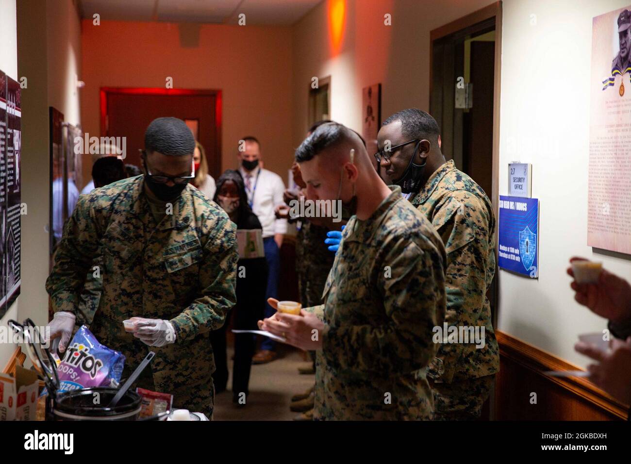 Participants sample a contestant’s chili during The Marine Corps ...
