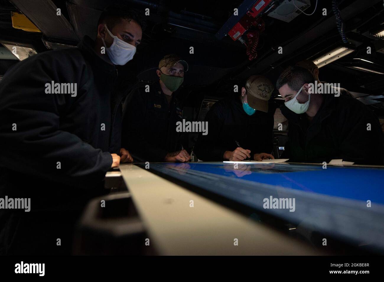 210304-N-QD512-1036 ATLANTIC OCEAN (March 4, 2021) Sailors plot targets ...