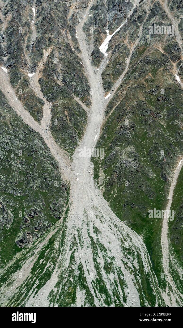 The texture of the mountain. The relief of a mountain slope with snow ...