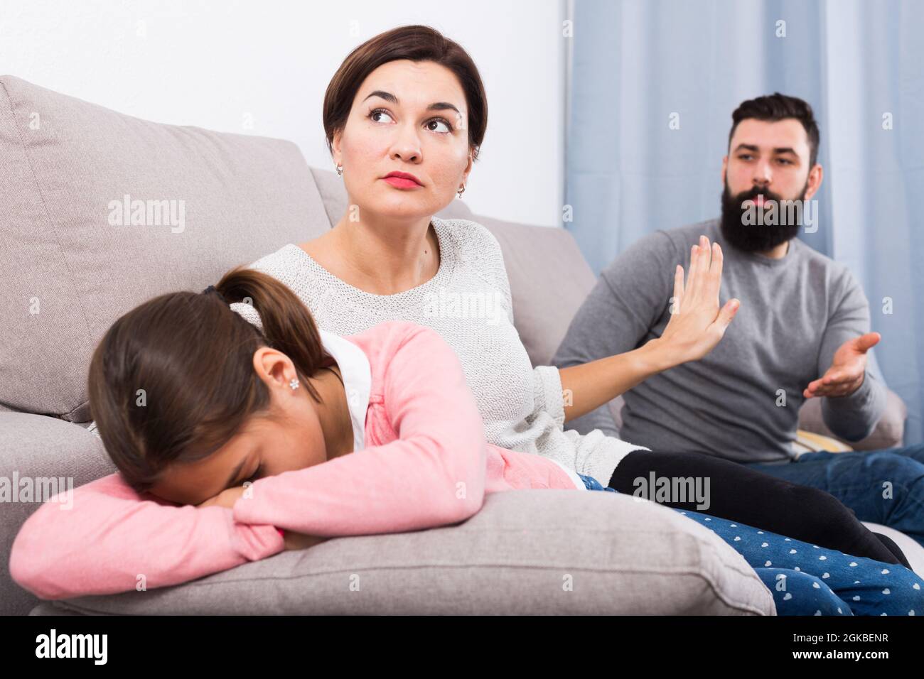 Father lecturing wife and daughter Stock Photo - Alamy