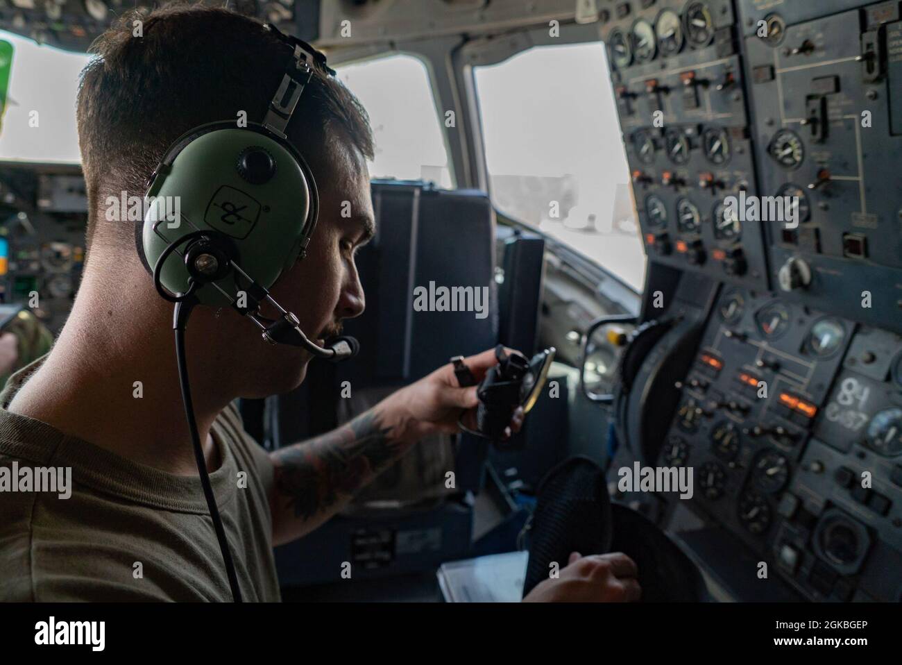 A U.S. Air Force KC-10 Extender aircraft crew member performs routine ...