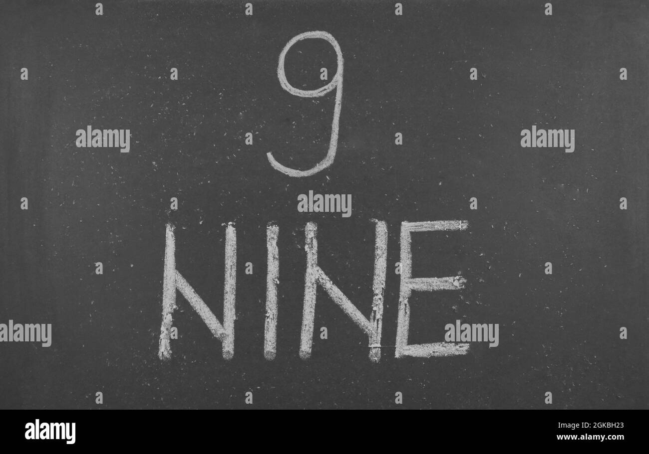 Number nine written in chalk on the blackboard Stock Photo - Alamy