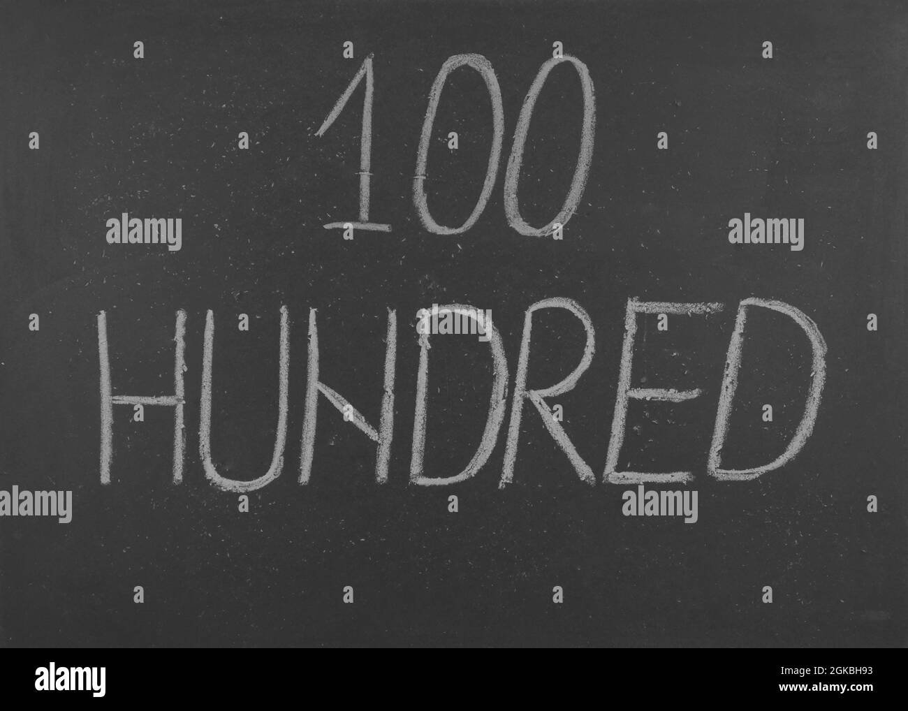 Number hundred written in chalk on the blackboard Stock Photo - Alamy