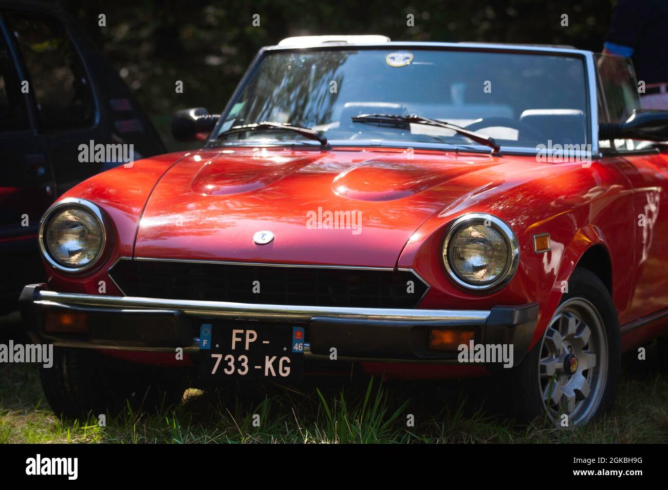 Red Fiat 124 Spider at Dégagnazès country fair, Lot department, France ...