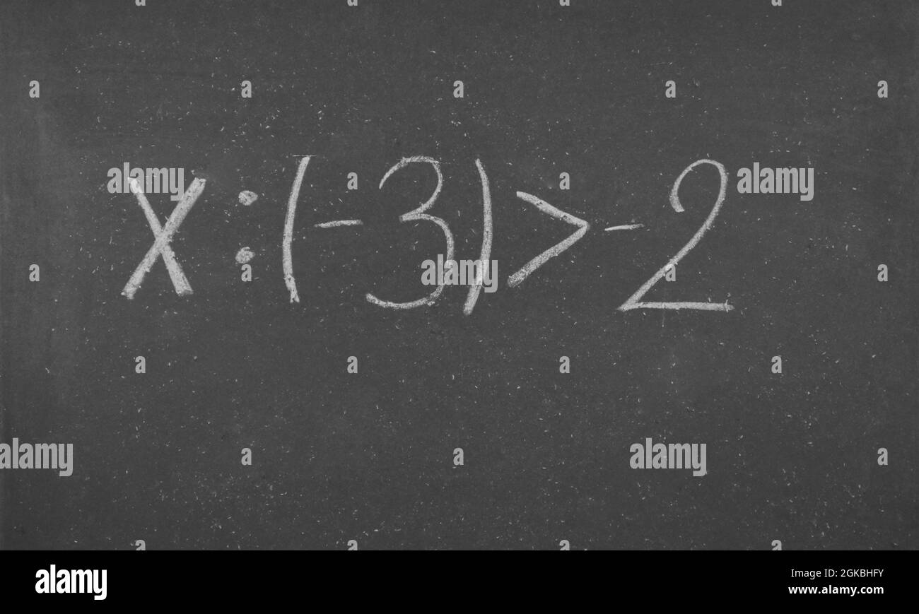 Math task for primary school written in chalk Stock Photo - Alamy