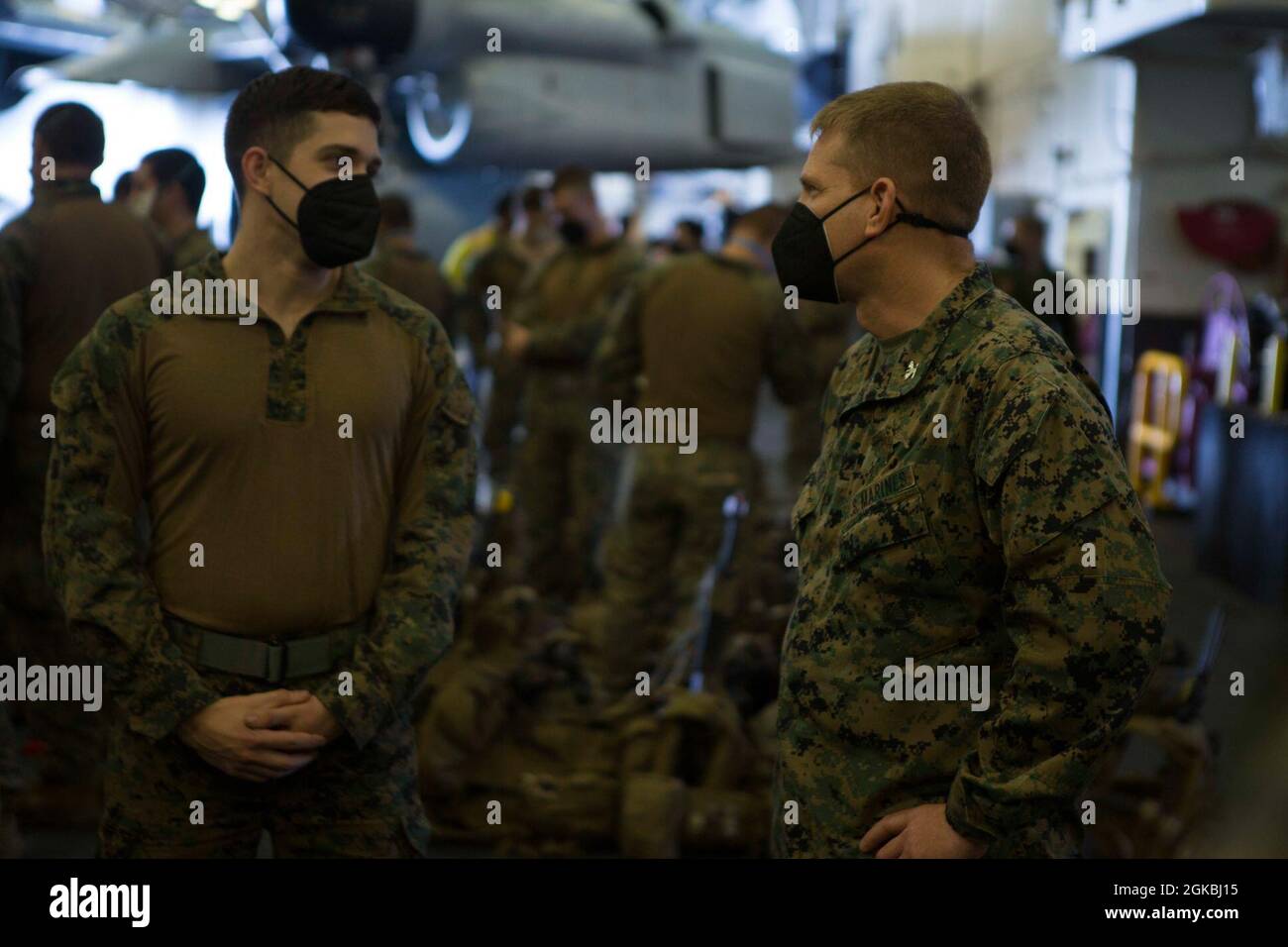 U.S. Marine Corps Col. Eric Cloutier (right), commanding officer, 24th ...