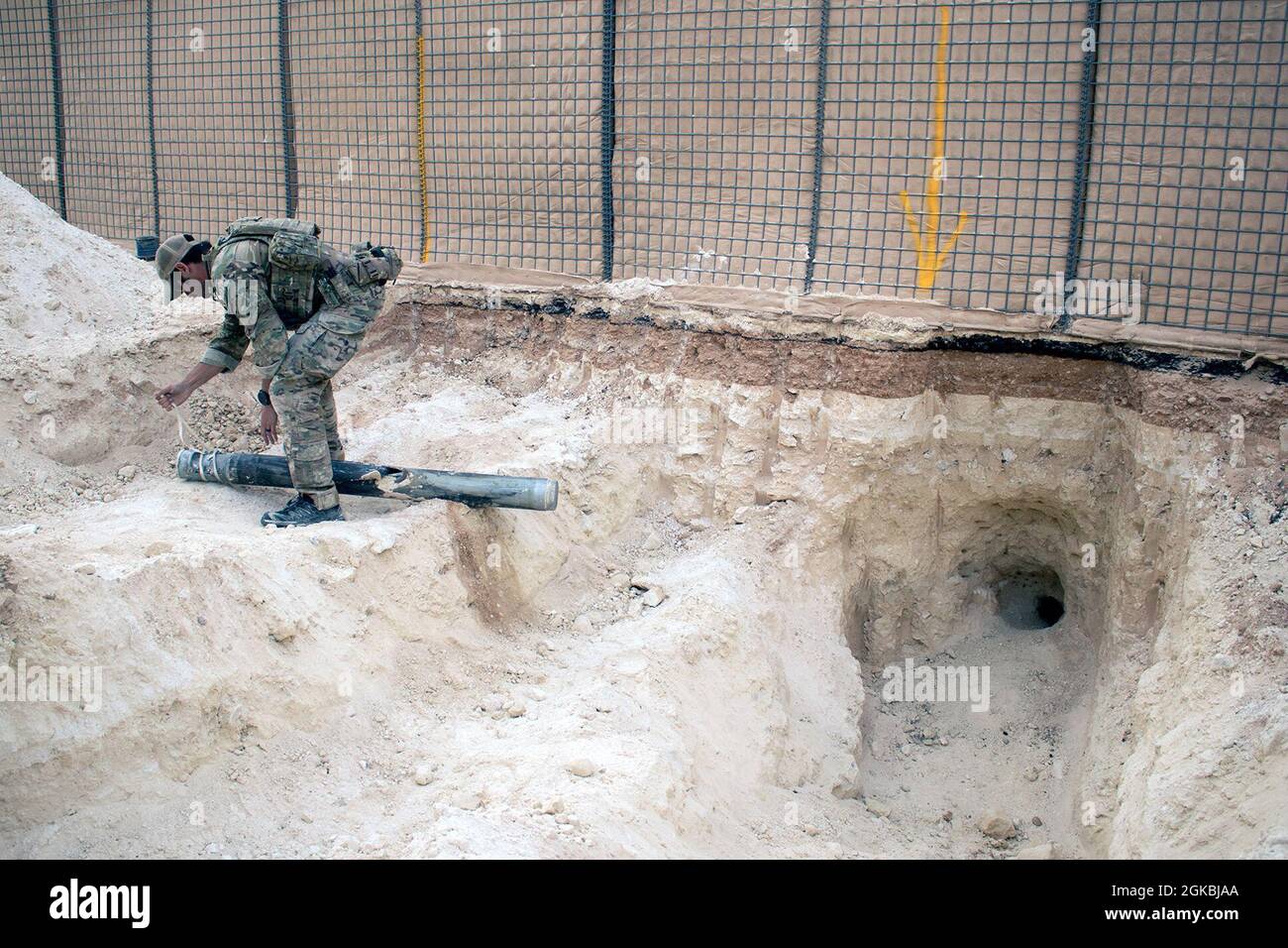 Explosive Ordnance Disposal specialists prepare to safely detonate an ...