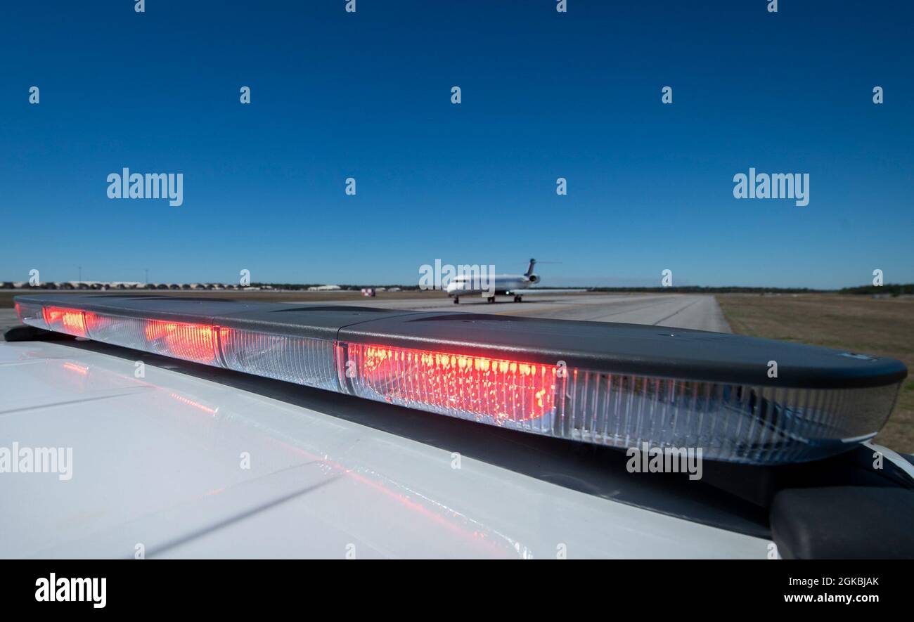 An Airfield Management vehicle pulls over the side of the taxiway as a ...