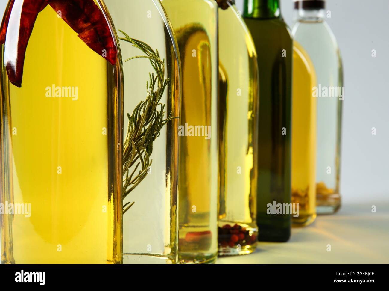 Bottles of cooking oil on light background, close up Stock Photo - Alamy
