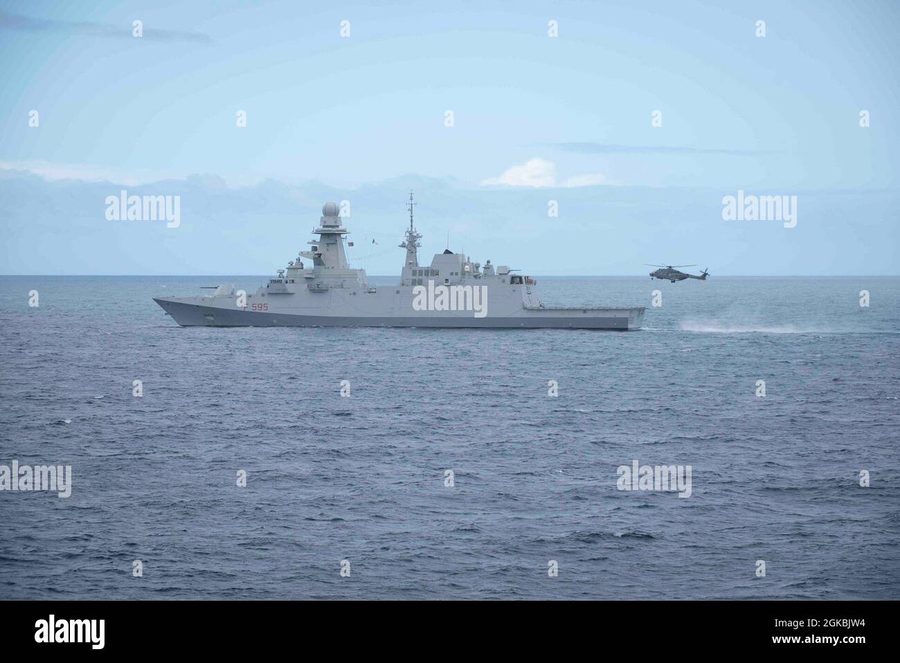 210305-N-QD512-1685 ATLANTIC OCEAN (March 5, 2021) An Italian Navy NH90 helicopter prepares to ...