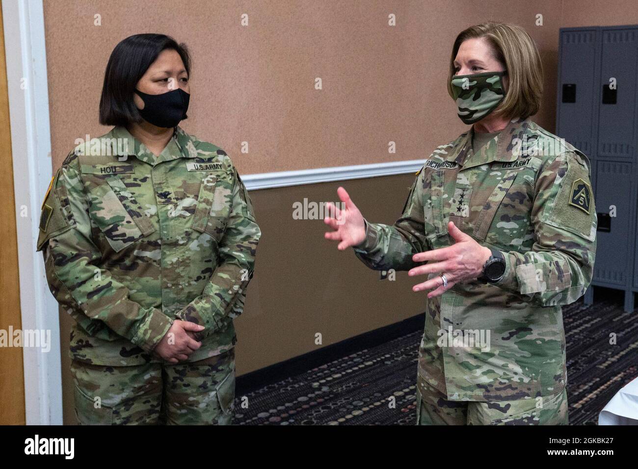 Col. Lisa J. Hou D.O., left, Interim Adjutant General, listens as U.S ...