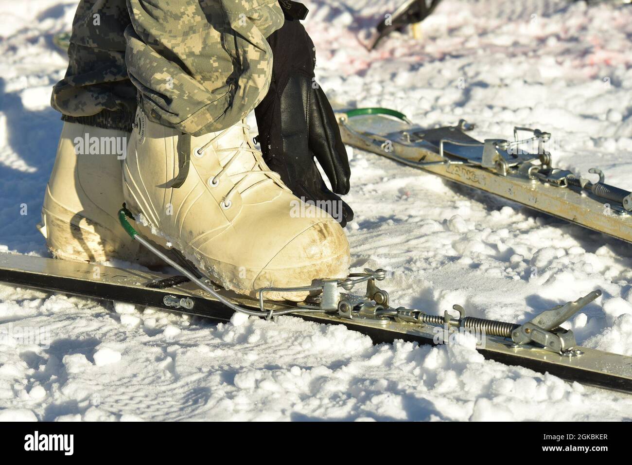 A competitor from the 1st Battalion, 5th Infantry Regiment straps on ...