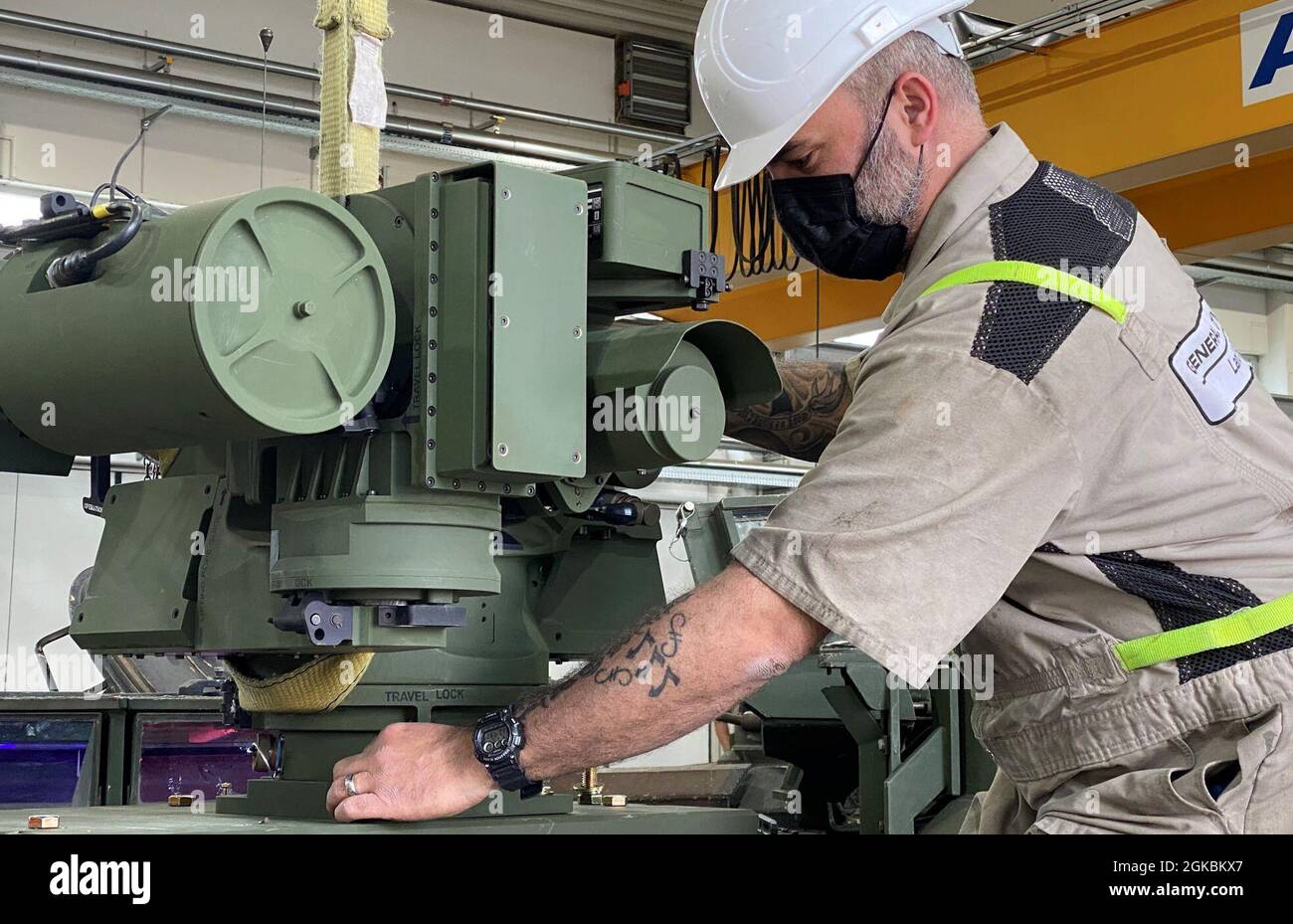 A mechanic at Coleman worksite installs a new, upgraded, lower-profile ...