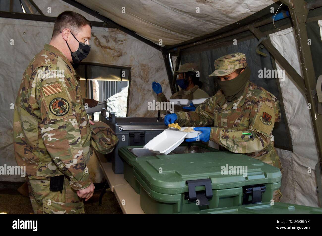 U.S. Air Force Master Sgt. Denise Bhola (right), 169th Force Support ...
