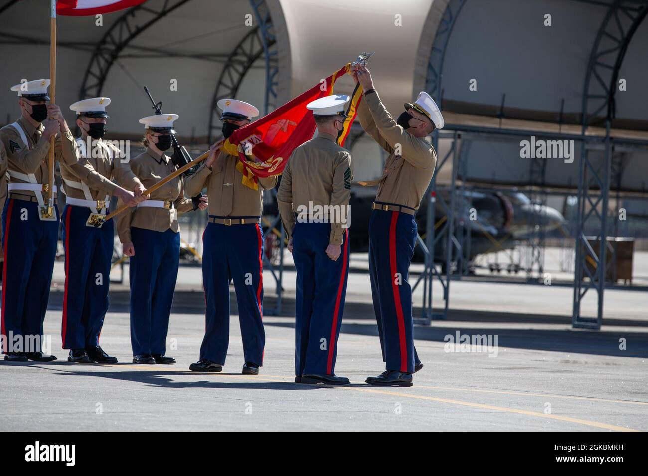 U.S. Marine Corps Lt. Col. Trevor Felter, right, attaches the ...