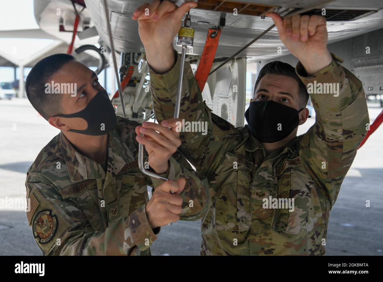 U.S. Air Force Staff Sgt. Brian Angle and Senior Airman Caleb Robino ...