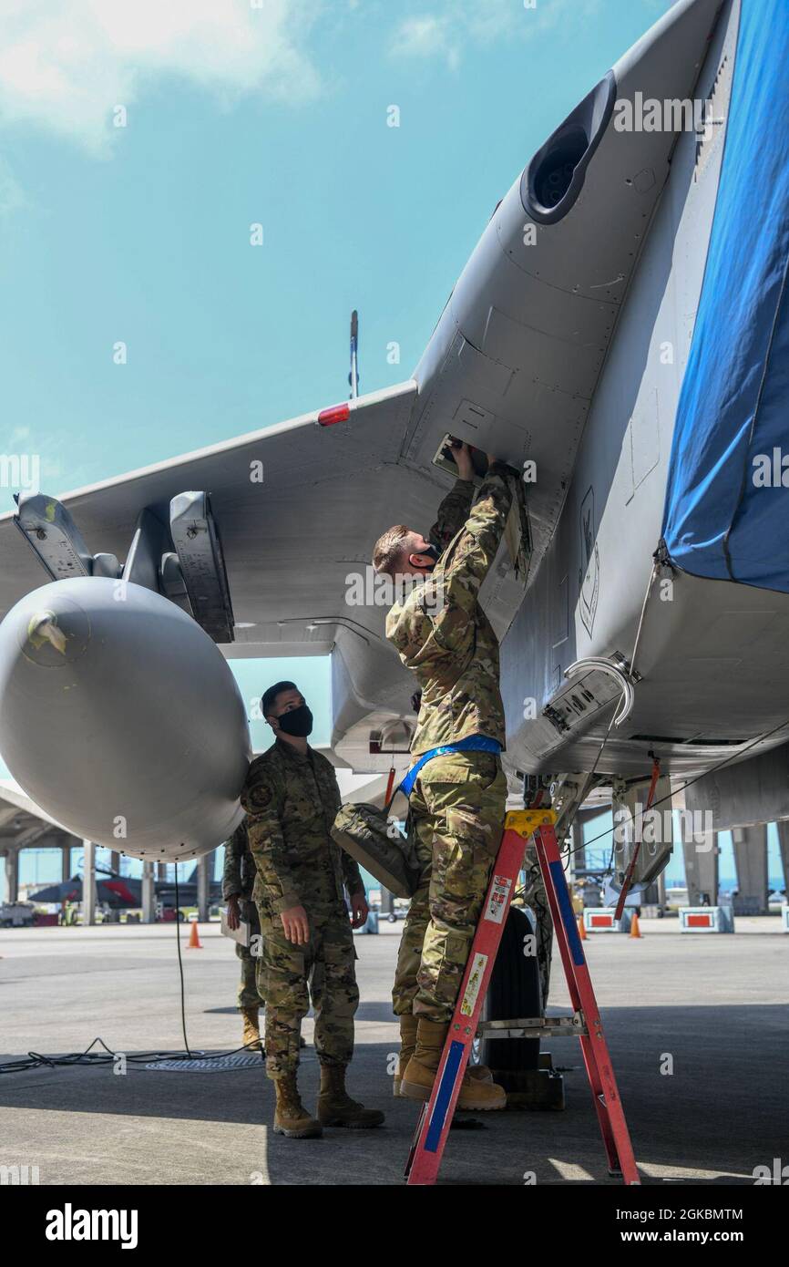 U.S. Air Force Airmen from the 18th Wing participate in a weapons load ...