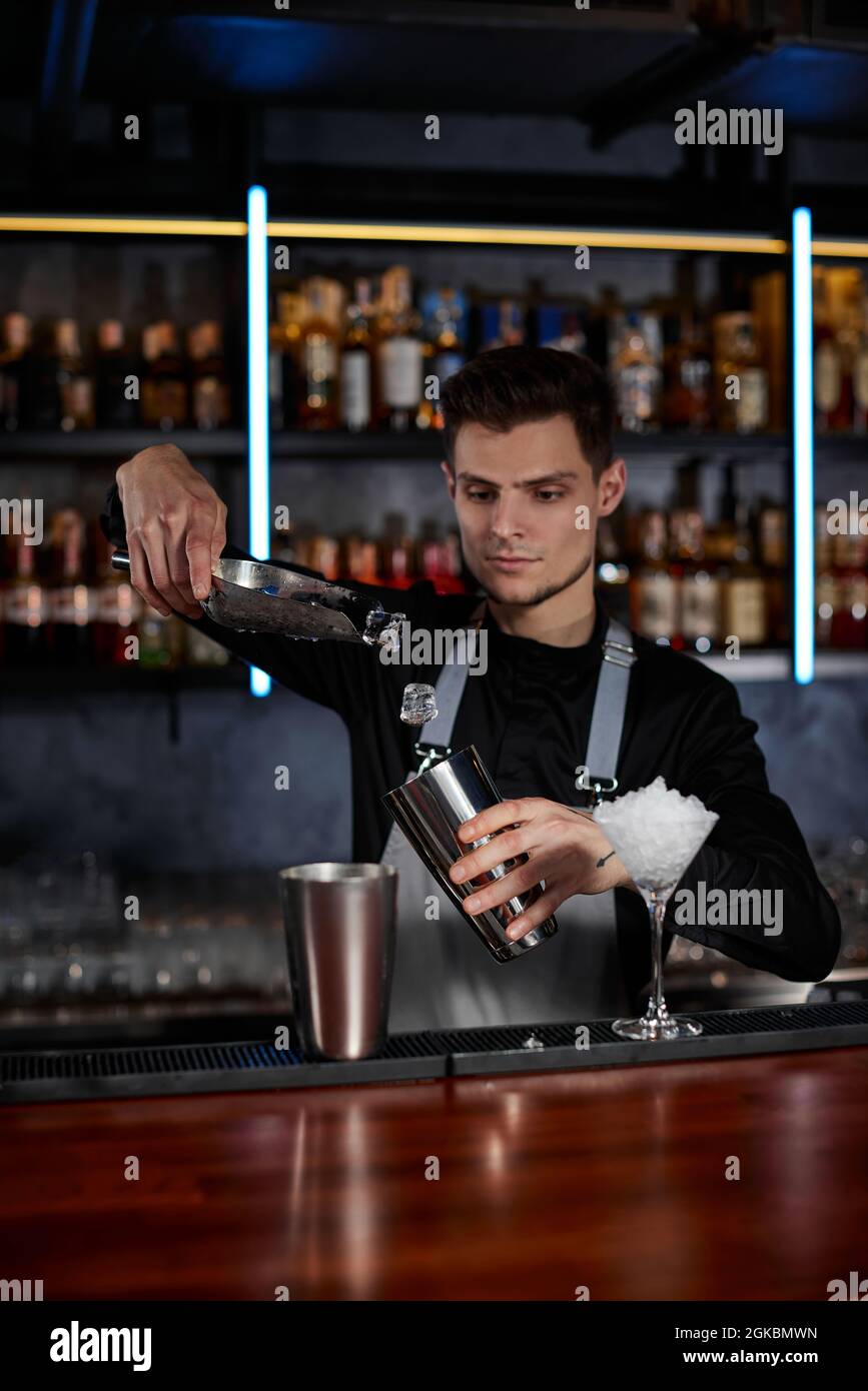 Barman pours transparent drink cocktail hi-res stock photography and ...
