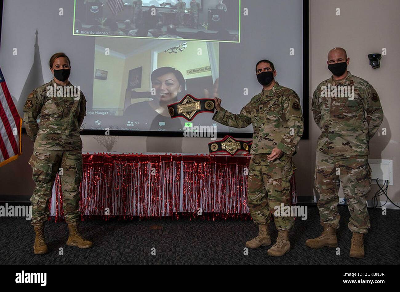 Lt. Col. Damien Williams, 37th Training Group deputy commander, accepts ...