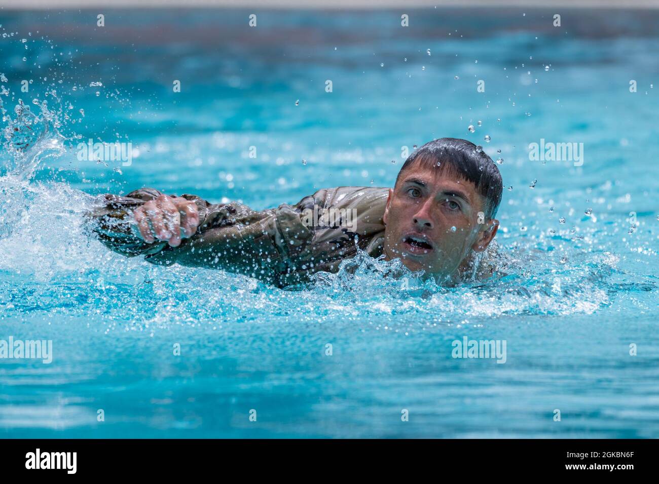 Spc. Michael J. Makinano swims his 100-meter swim in a OCP uniform for ...