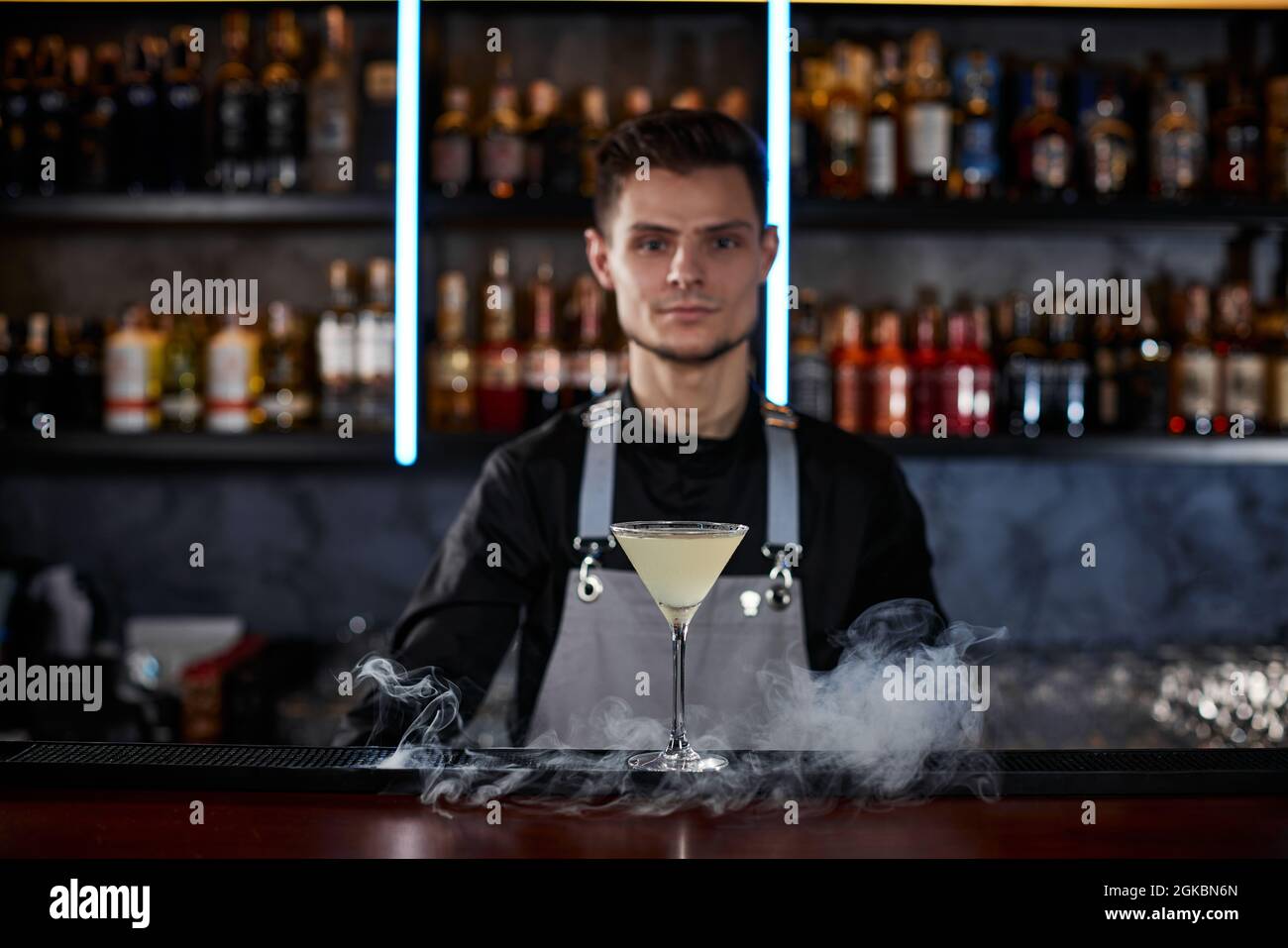 alcoholic cocktail with smoke on the bar table Stock Photo - Alamy