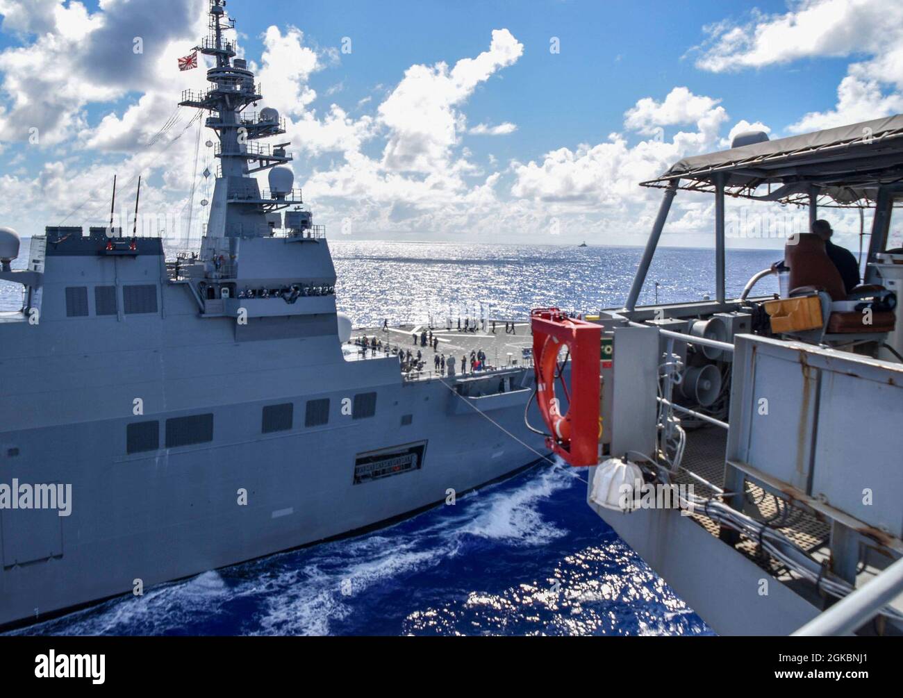 Capt. Bobby Summers, master of USNS Ericsson (T-AO 194), supervises a ...