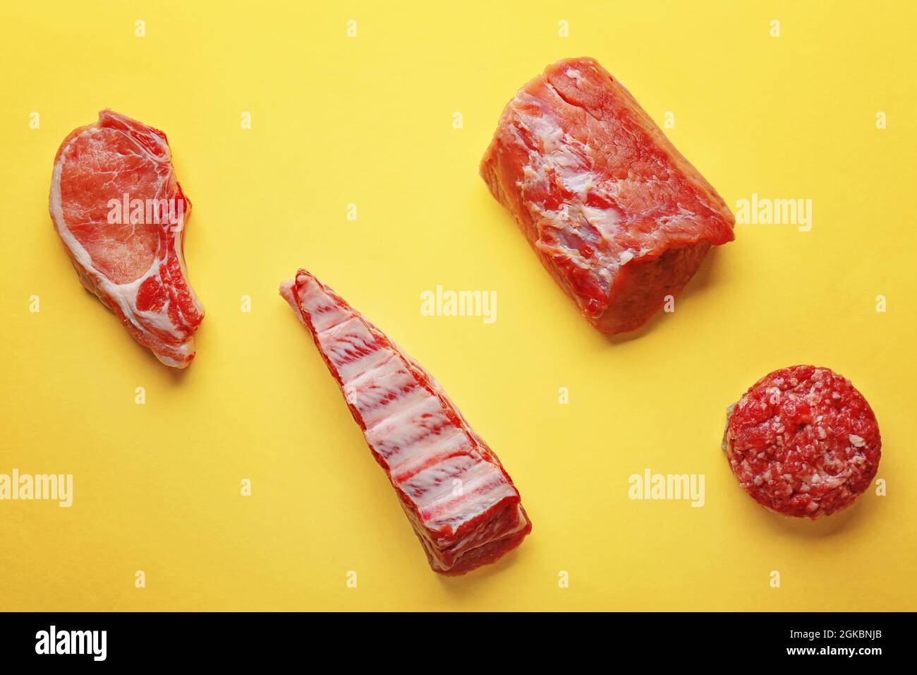 Pieces of different fresh meat on color background Stock Photo - Alamy