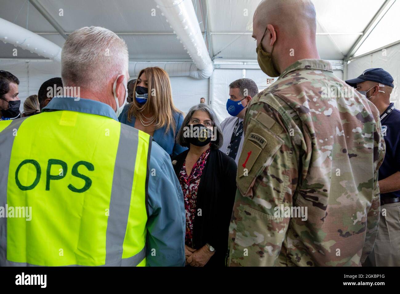 Charlie McDermott, left, the Florida Department of Emergency Management ...