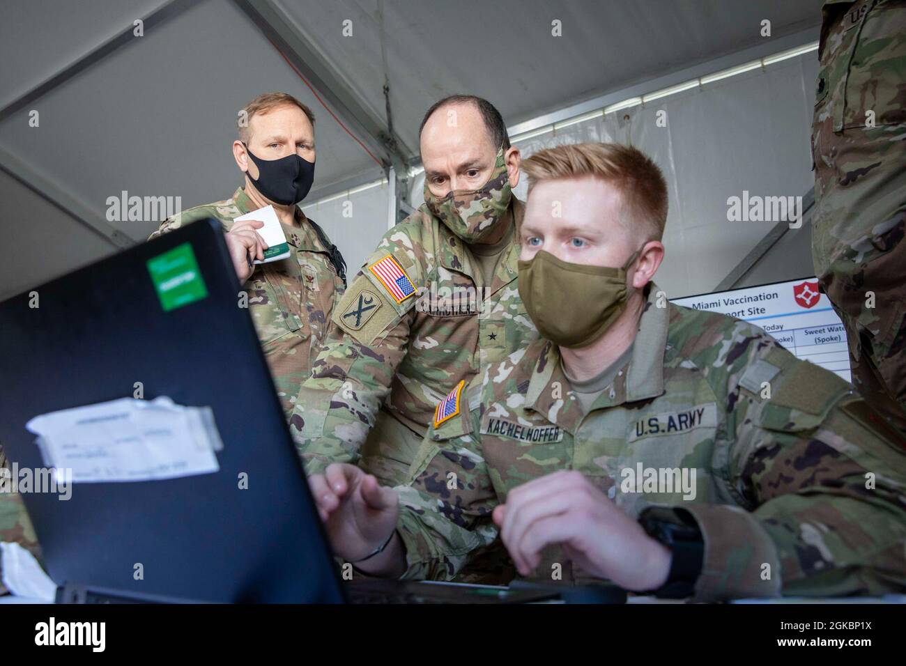 U.S. Army Brig. Gen. Robert G. Carruthers, center, the Dual Status ...