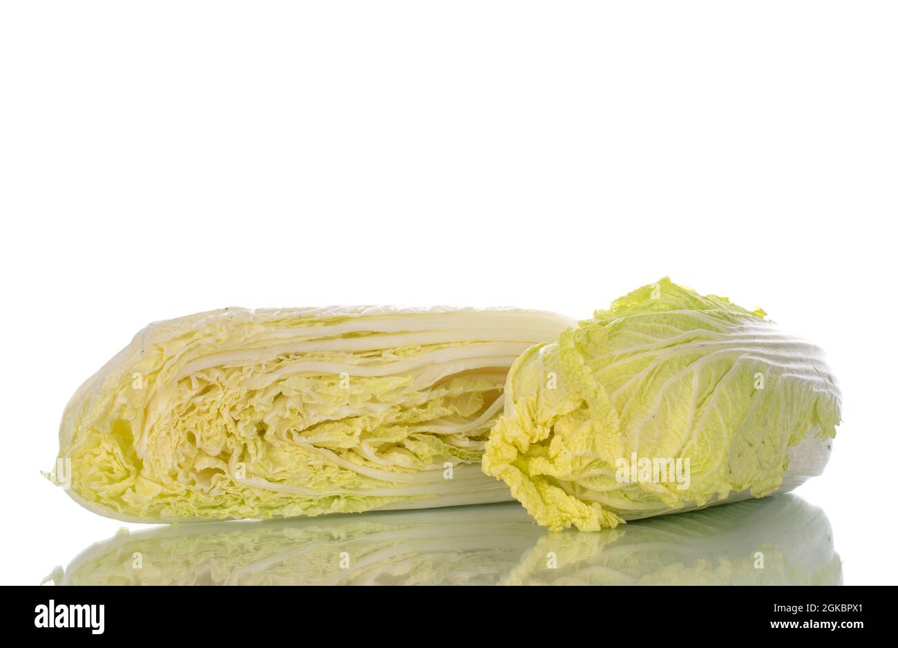 Two half ripe fresh Peking cabbage, close-up, isolated on white Stock ...