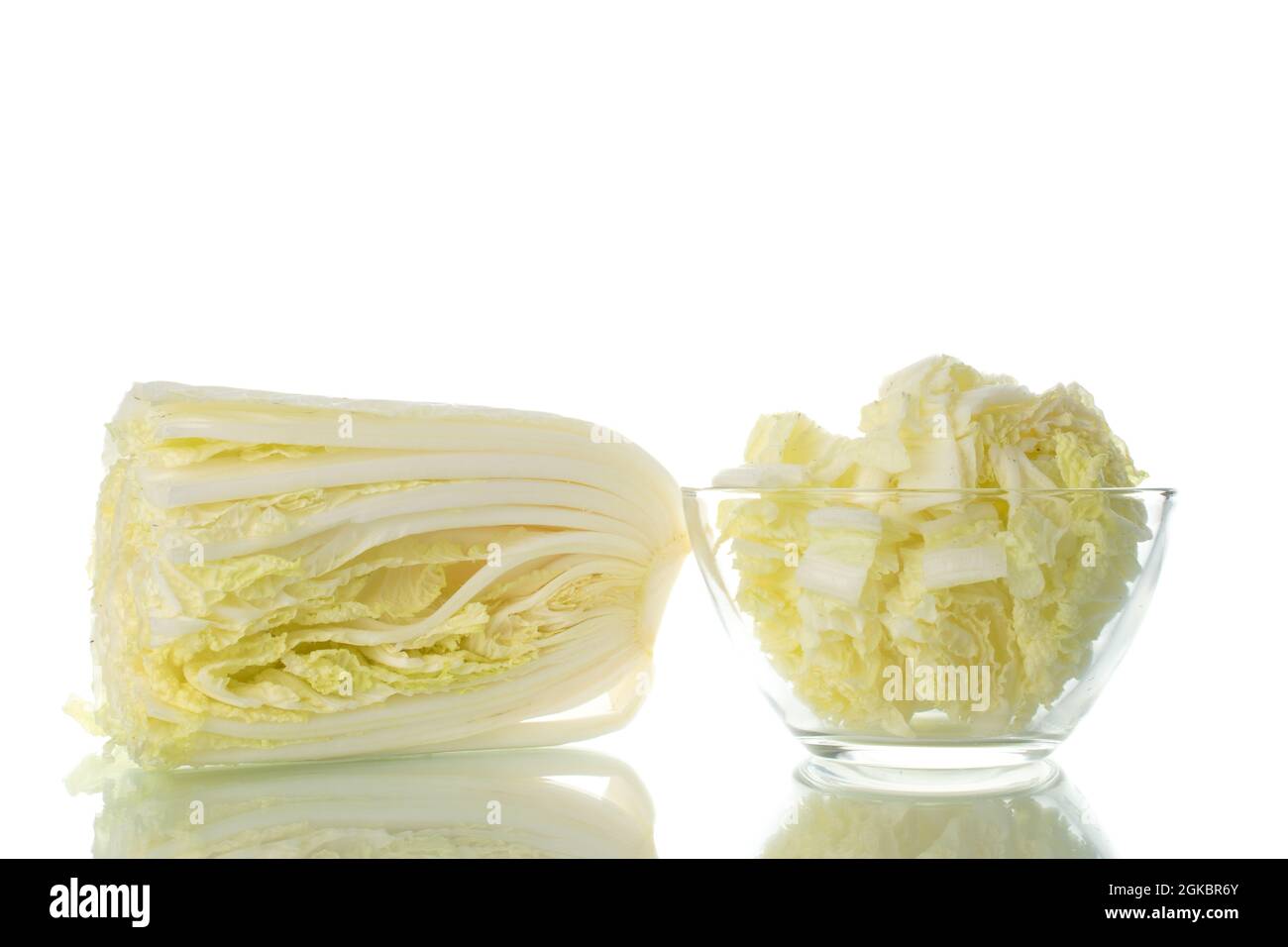One half of ripe fresh Chinese cabbage and shredded cabbage in a glass ...