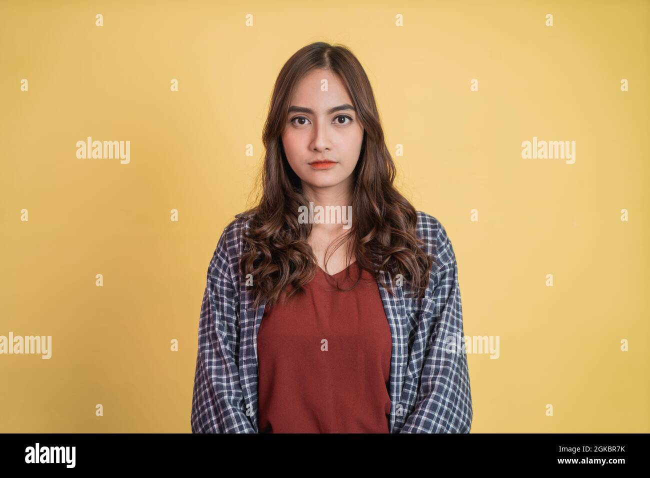 beautiful young woman with long hair with sullen expression Stock Photo ...