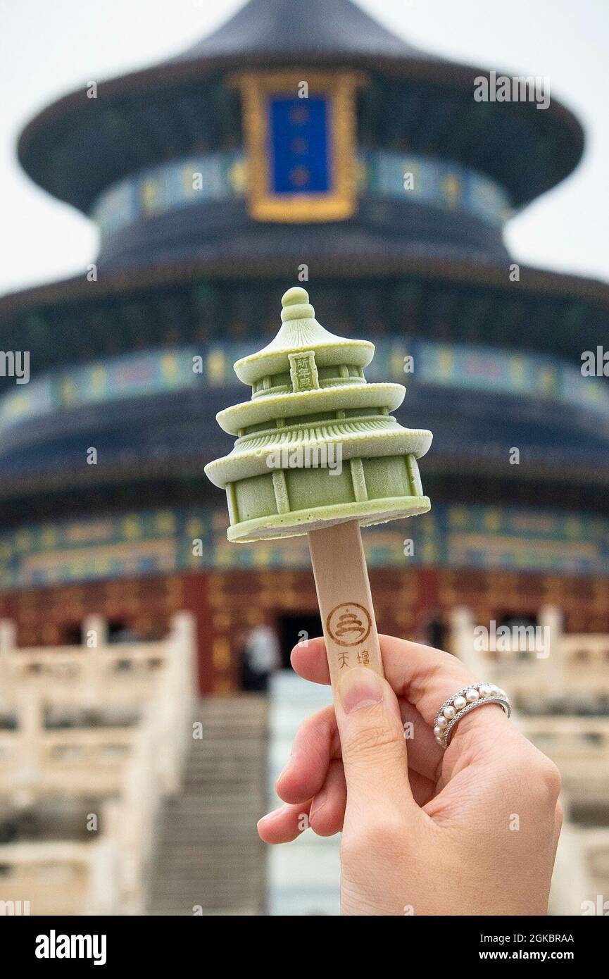 Beijing, China. 14th Sep, 2021. A tourist holds an ice cream in a shape ...