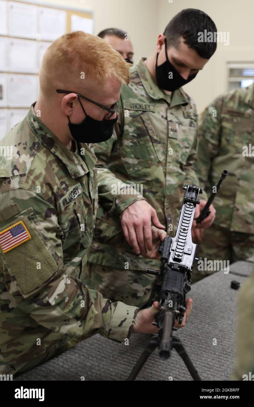 Officer candidates disassemble an M240B machine gun March 6, 2021 at ...