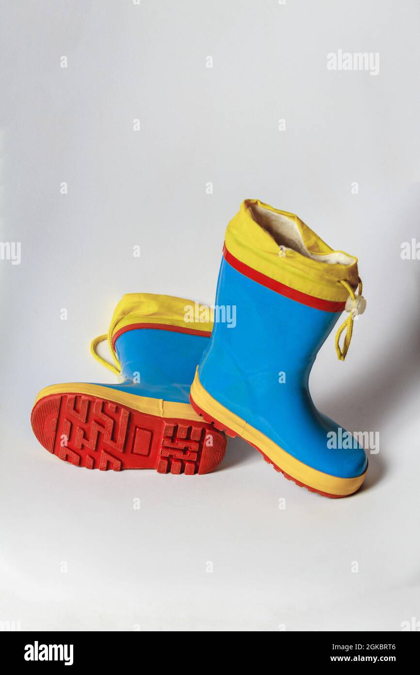 Children rubber boots on a white background Stock Photo - Alamy