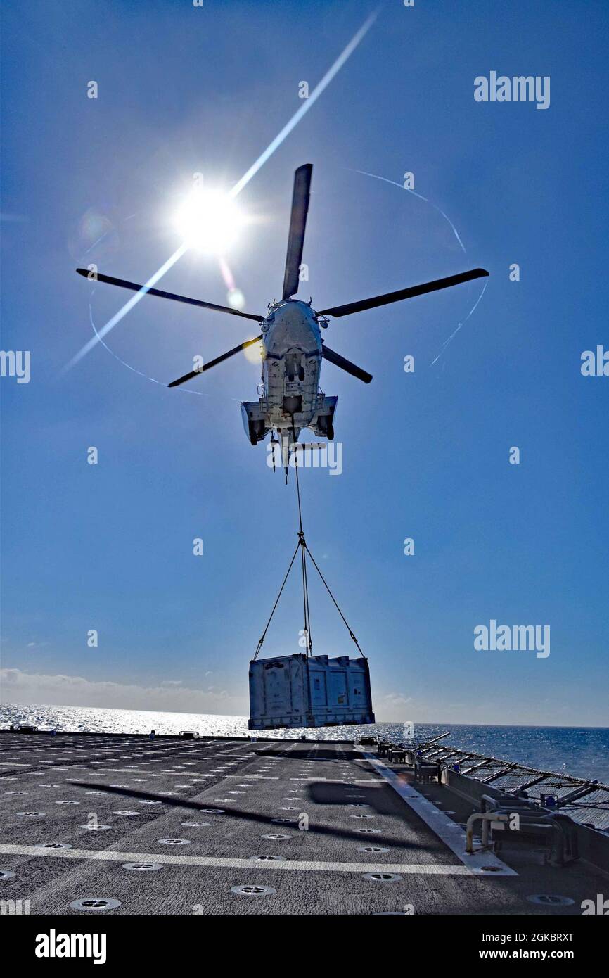 A helicopter conducts operations during the Navy’s first at-sea ...