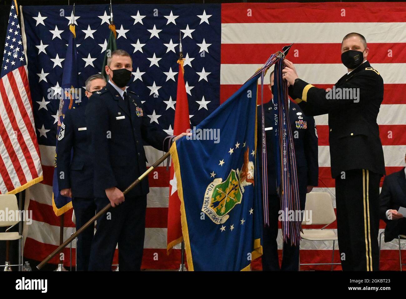 Col. Darrin Anderson, 119th Wing commander, holds the 119th Wing’s unit ...