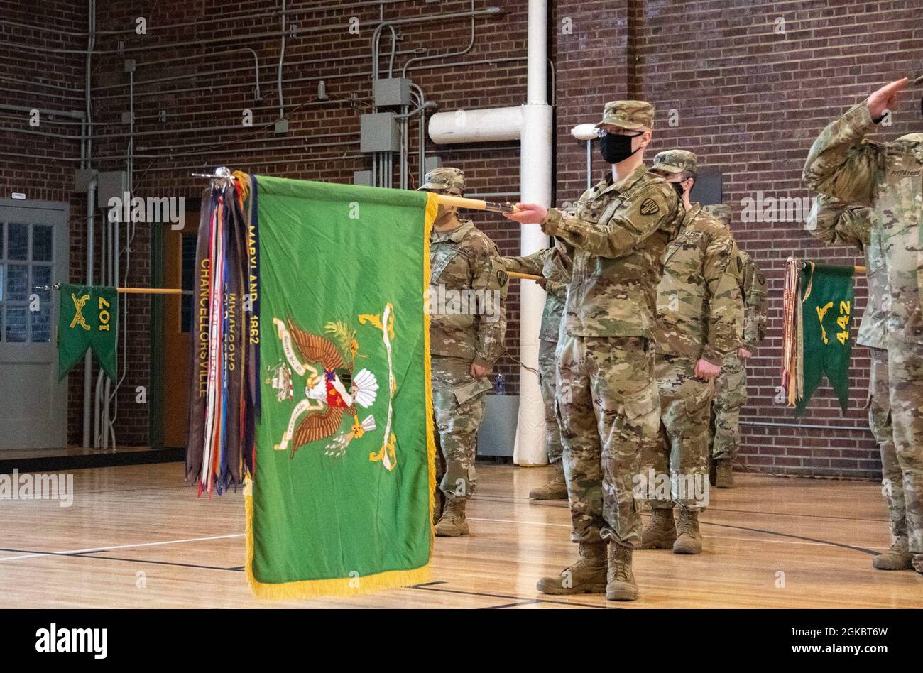 Soldiers of the 104th Military Police Battalion salutes during a change ...
