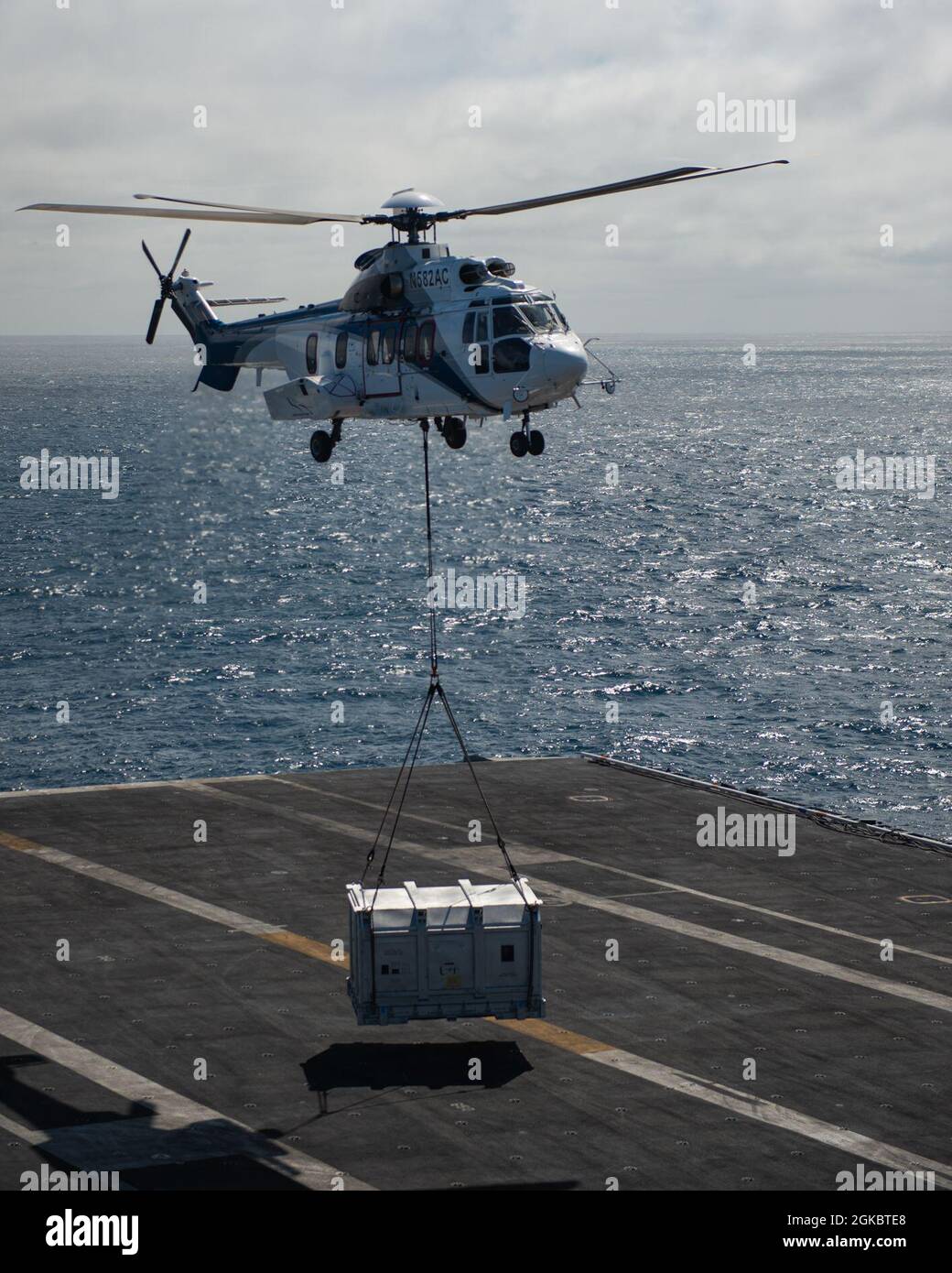 210306-N-CW190-1264 PACIFIC OCEAN (Mar. 6, 2021) A civilian H225 Super ...