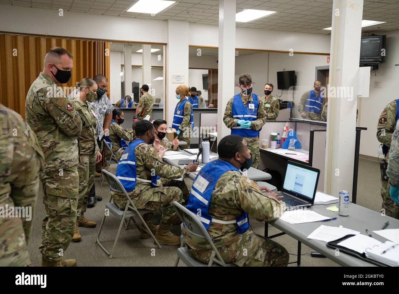 Airmen working the personnel deployment function line during the wing ...
