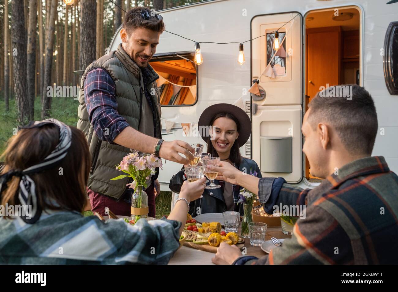 Group toasting over dinner hi-res stock photography and images - Alamy